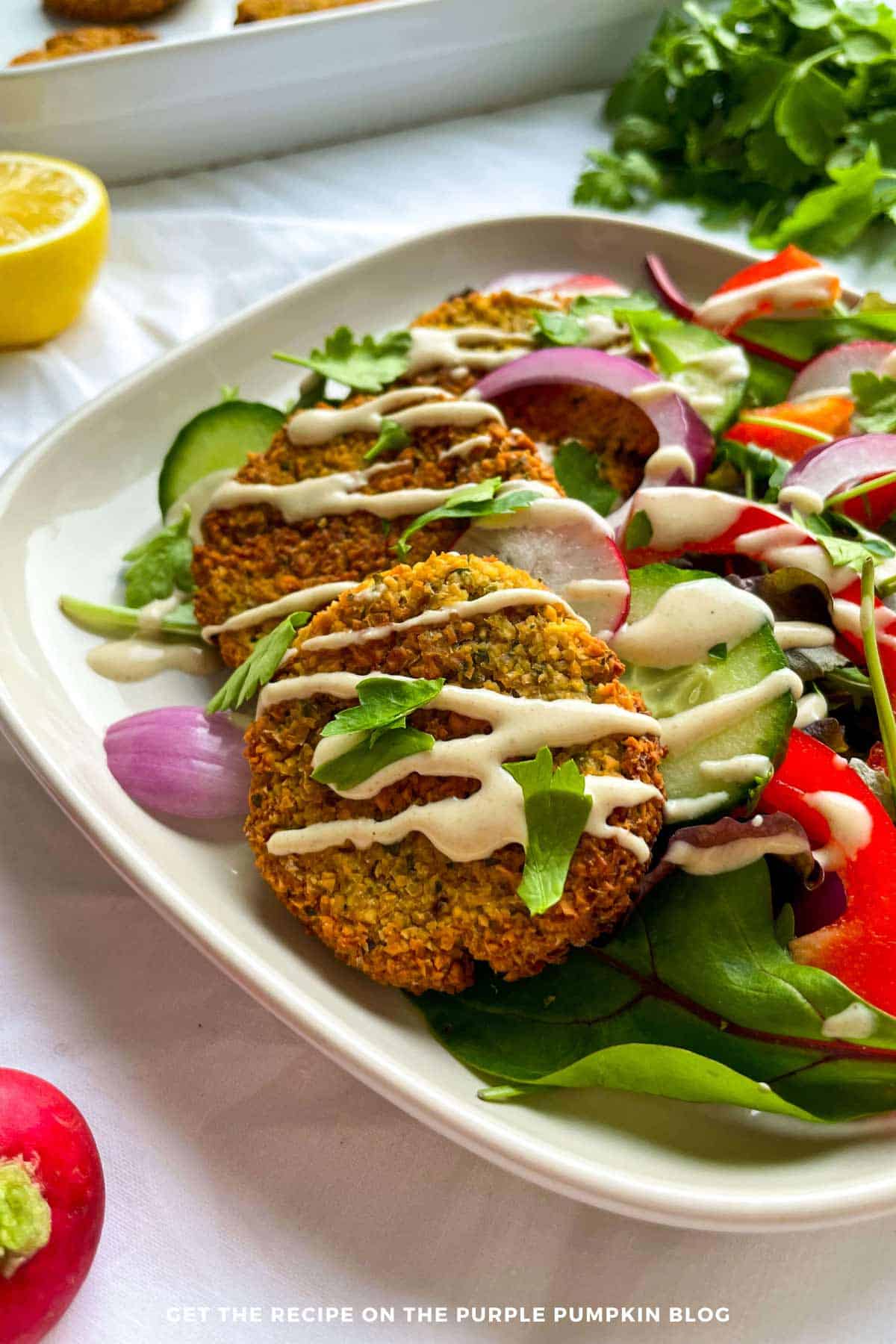 Crispy Baked Falafel Salad with Lemony Tahini Sauce
